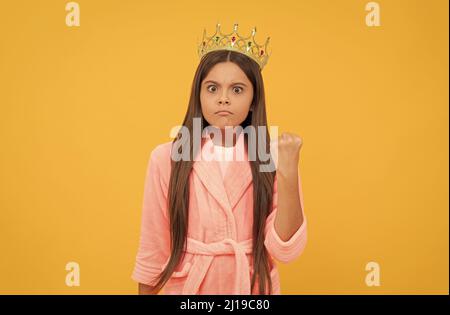 angry selfish teen girl in home terry bathrobe and princess crown ...