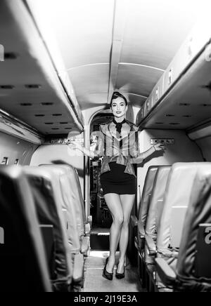 Smiling Flight attendant waiting for the passengers to board Stock ...