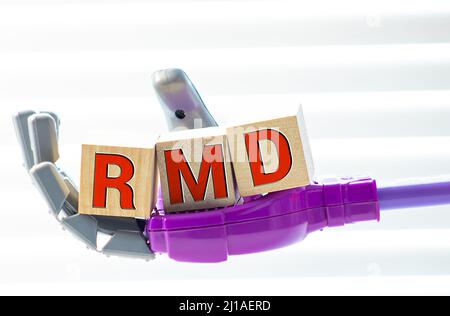wooden block with words RMD required minimum distributions Stock Photo ...