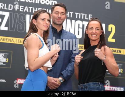 Sky Nicolson (left) and Bec Connolly face off as Eddie Hearn looks on ...