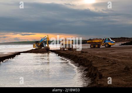 Digger and lorries on Montrose beach in Scotland as part of works to ...