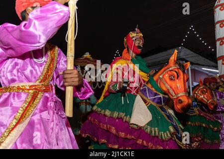 Group of men dressed as horse mounted soldiers, in colourful attire ...