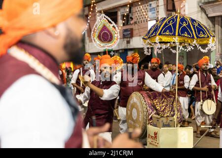 Dhol, tasha and cymbal being played by men dressed in traditional ...