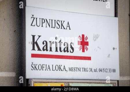 Picture of a sign with the logo of Caritas Internationalis on their ...
