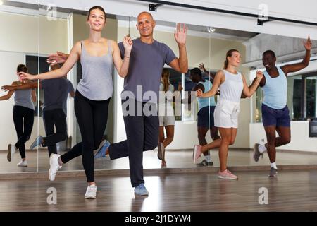 People practicing dance movements in class Stock Photo - Alamy