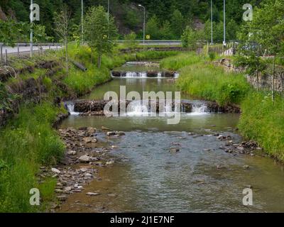 Small artificial river cascade with rocks Stock Photo - Alamy