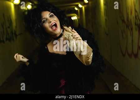 Freaky woman with a bottle of alcohol in the paper bag Stock Photo - Alamy