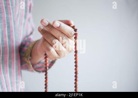 muslim man keep hand in praying gestures during ramadan, Close up Stock ...