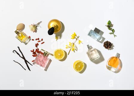 Bottles of different perfumes on light background, top view Stock Photo ...