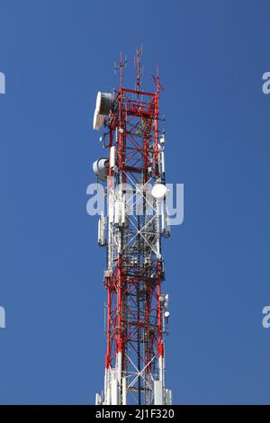 Telecom base station in Poland. Cell tower sector antennas. Mobile 5G transmitter equipment ...