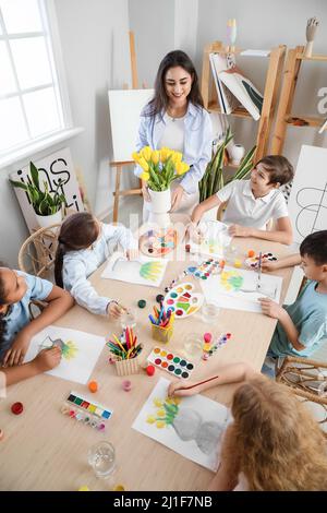 Cute children painting during master-class in art Stock Photo - Alamy