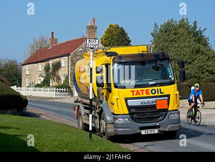 Tate oil lorry, delivering domestic heating oil to house in the village ...