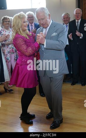 The Prince of Wales is shown the steps of a traditional Irish dance at ...