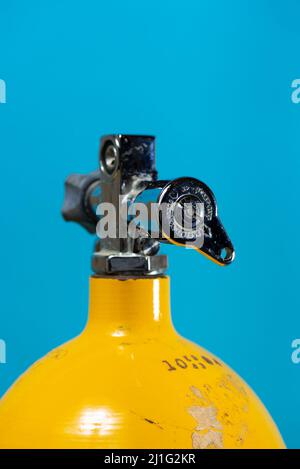 J valve in the open position on a vintage yellow steel scuba tank Stock ...