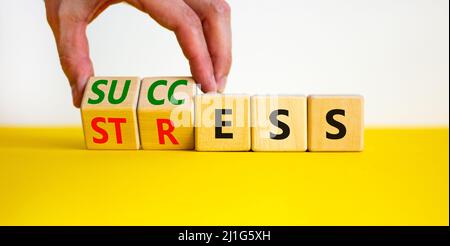 Success instead of stress symbol. Businessman turns cubes and changes ...