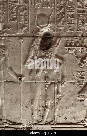 The goddess Hathor or Isis breastfeeding a Ptolemaic pharaoh, defaced ...