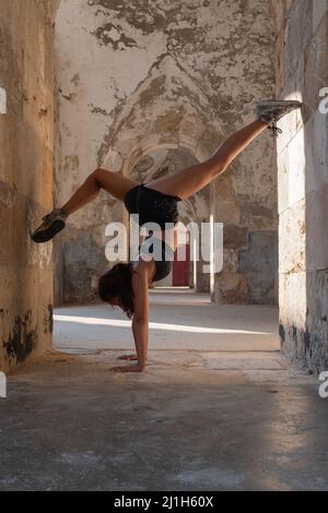 Handstand with split yoga pose woman show on studio background Stock ...