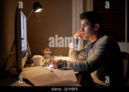 All night study sessions. a young student studying late into the night ...