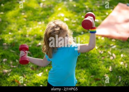 Boy Doing Exercises with Dumbbells in the Gym: Fitness Workout Stock ...