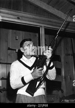 CLARK GABLE showing his Gun Collection at his Ranch Home in Encino ...