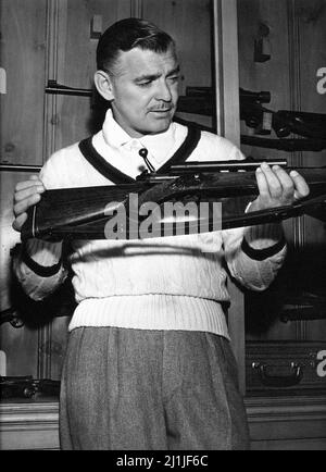 CLARK GABLE showing his Gun Collection at his Ranch Home in Encino ...