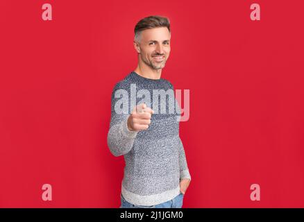 hair and skin care. happy grizzled guy in sweater on red background ...