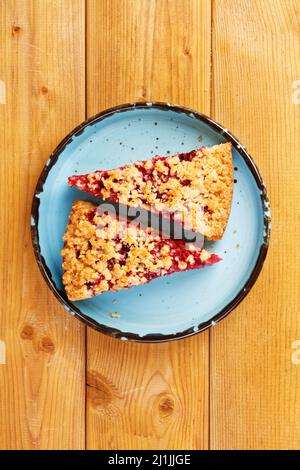 Piece of tart with fresh raspberries, on wooden background Stock Photo ...