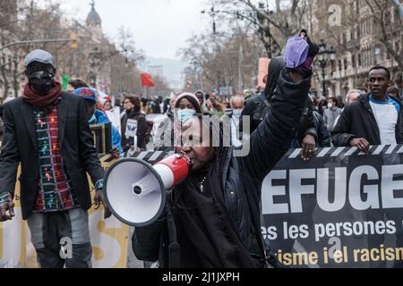 A protester speaks through a megaphone during a demonstration against ...