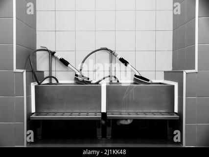 Clean sports shoes in washing machine drum Stock Photo - Alamy
