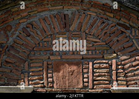 Stone and brick wall of Aghia Fotini a peculiar Christian church with ...