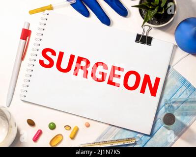 The word surgery made of red letters on a blue background. The concept ...