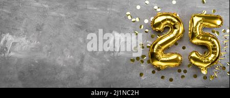 number twenty five, gold foil balloon number on blue velvet background ...