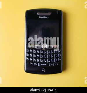 Old telephone on yellow background with copy-space Stock Photo - Alamy