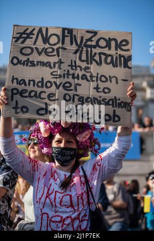 A protestor holds a placard expressing his opinion during the ...