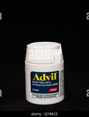 A white plastic bottle of 24 coated tablets of Advil, 200 mg Ibuprofen ...