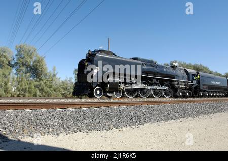 Engineer of Union Pacific 844 steam engine clears the track ahead, as ...