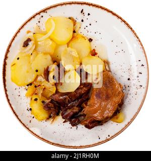 Portion of duck confit on table Stock Photo - Alamy