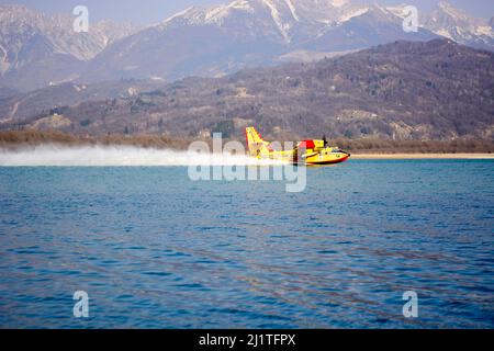 Aerial view of a Canadair firefighting water bomber airplane scooping ...