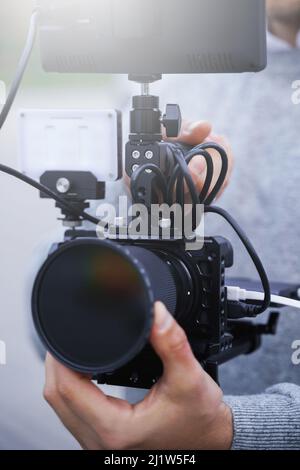 Videographer with a modern mirrorless camera rig Stock Photo - Alamy