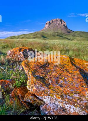 birdtail butte above the prairie and lichen-covered boulders near simms ...