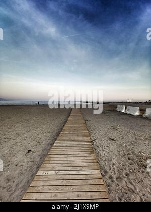 Beautiful shot of a footpath leading to the seashore Stock Photo - Alamy