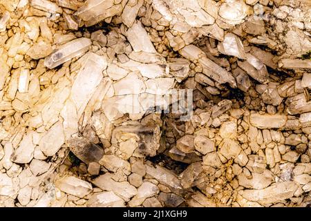 quartz mine, detail of raw crystals on the wall of a mine, concept of ...