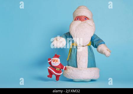 happy santa claus holds empty board to side while standing on white ...