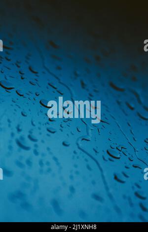 Raindrops on a window with rivulets of water runnng down the pane Stock Photo - Alamy