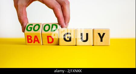 Good or bad guy symbol. Businessman turns cubes and changes concept ...