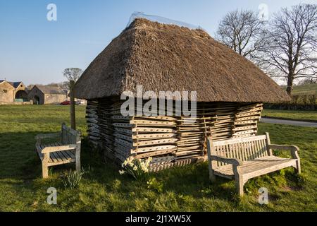UK, England, Somerset. Priddy village green. A stack of Hurdles was ...