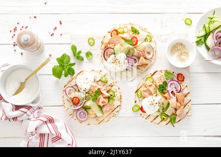 Spicy tacos with grilled salmon, vegetables, ricotta cheese, chili and ...