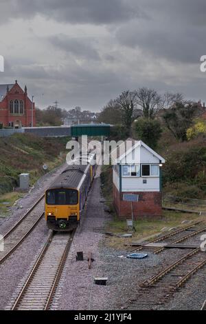 Poulton Le Fylde mechanical railway signal box with a Northern Rail class 156 sprinter train ...