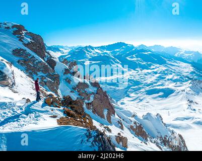 Snowboarder standing on the edge of the cliff in Austrian Alps Stock ...