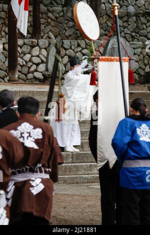 iida, nagano, japan, 2022/24/03, Shintoist priest greeting the crowd ...